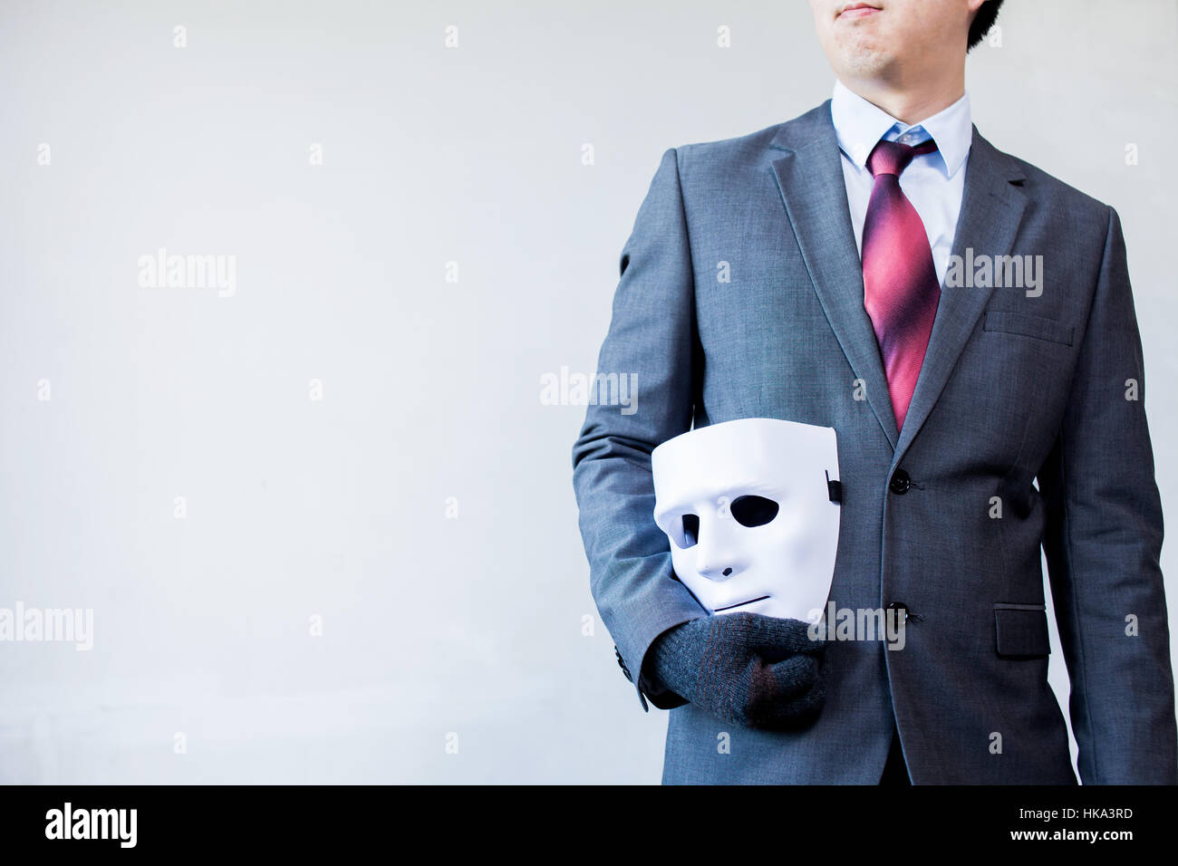 Business man carrying white mask to his body indicating Business fraud ...