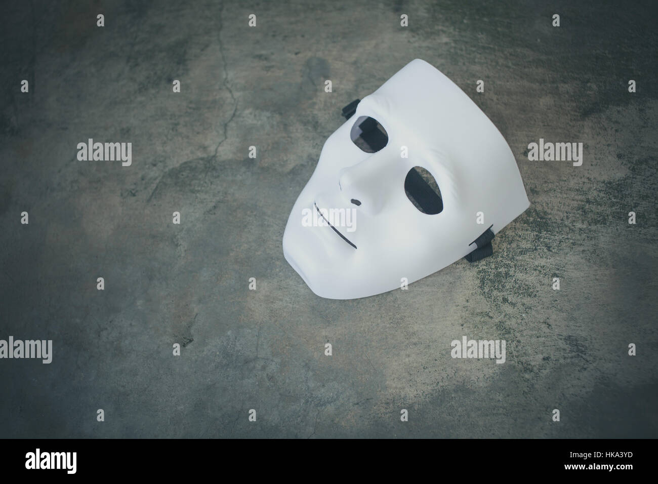White mask on dark grunge texture Stock Photo - Alamy