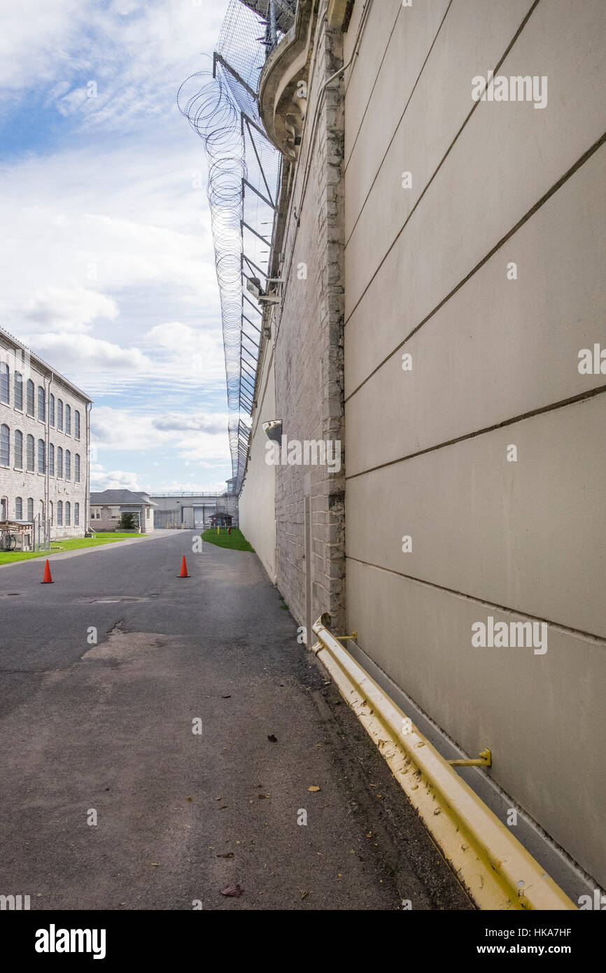 Looking down the barbed topped prison wall from the inside the prison ...