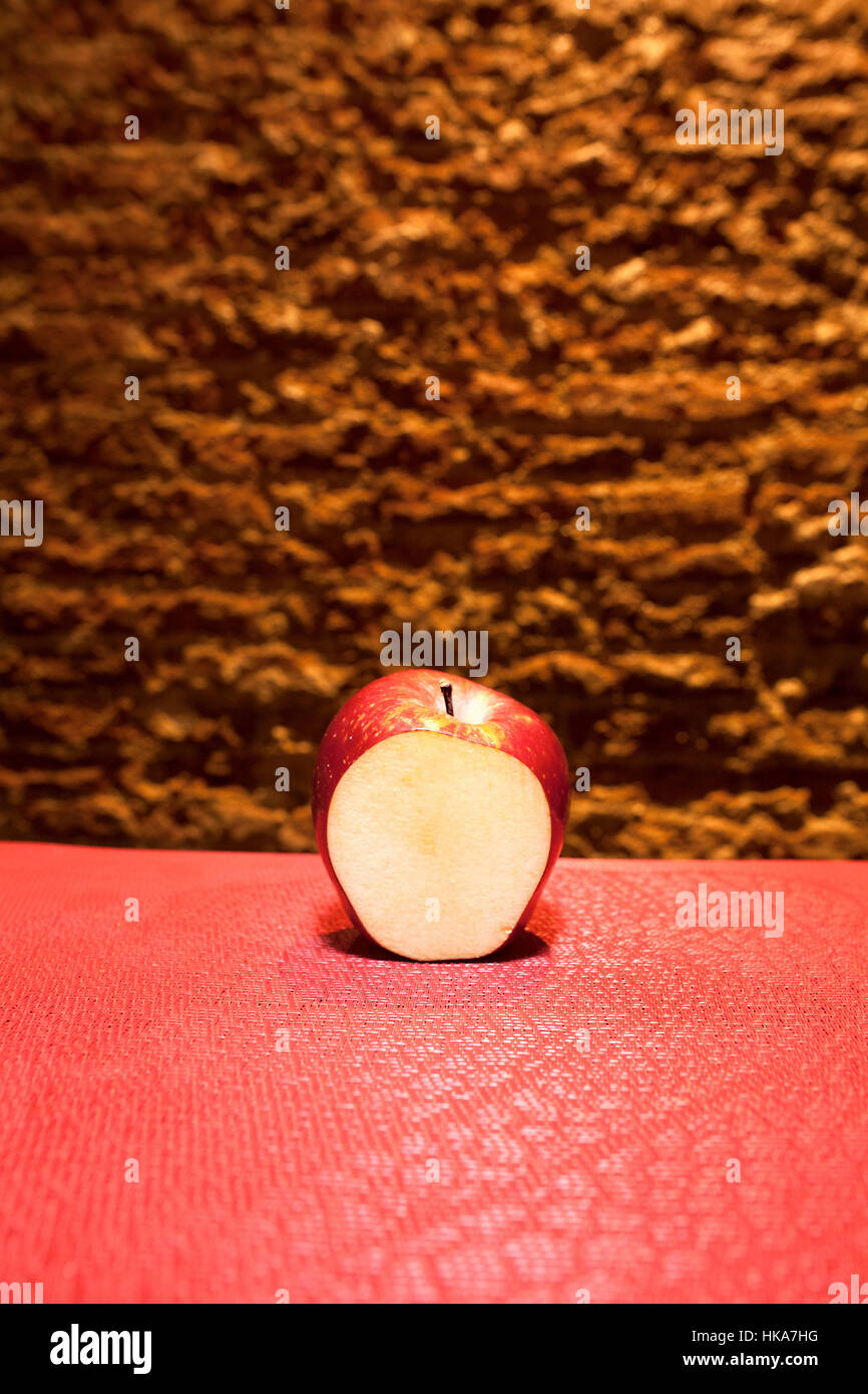 Sliced apple on a red table Stock Photo - Alamy