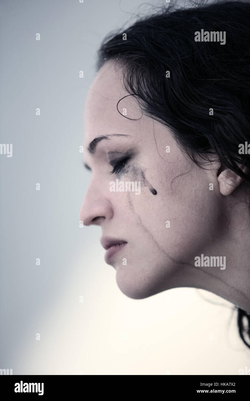 Portrait of a young crying brunette Stock Photo - Alamy
