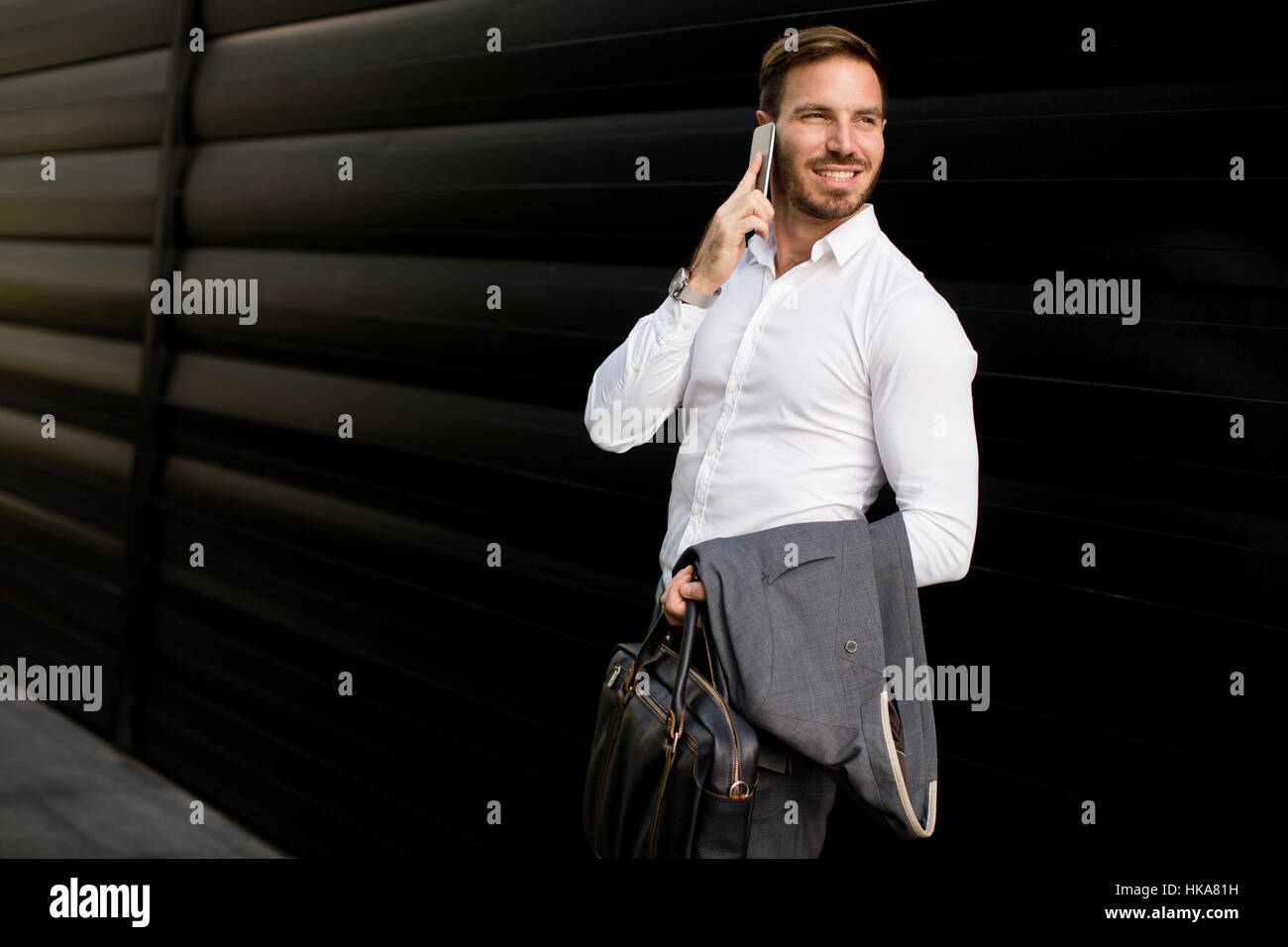 Young businessman outdoor and talking over the mobile phone Stock Photo ...