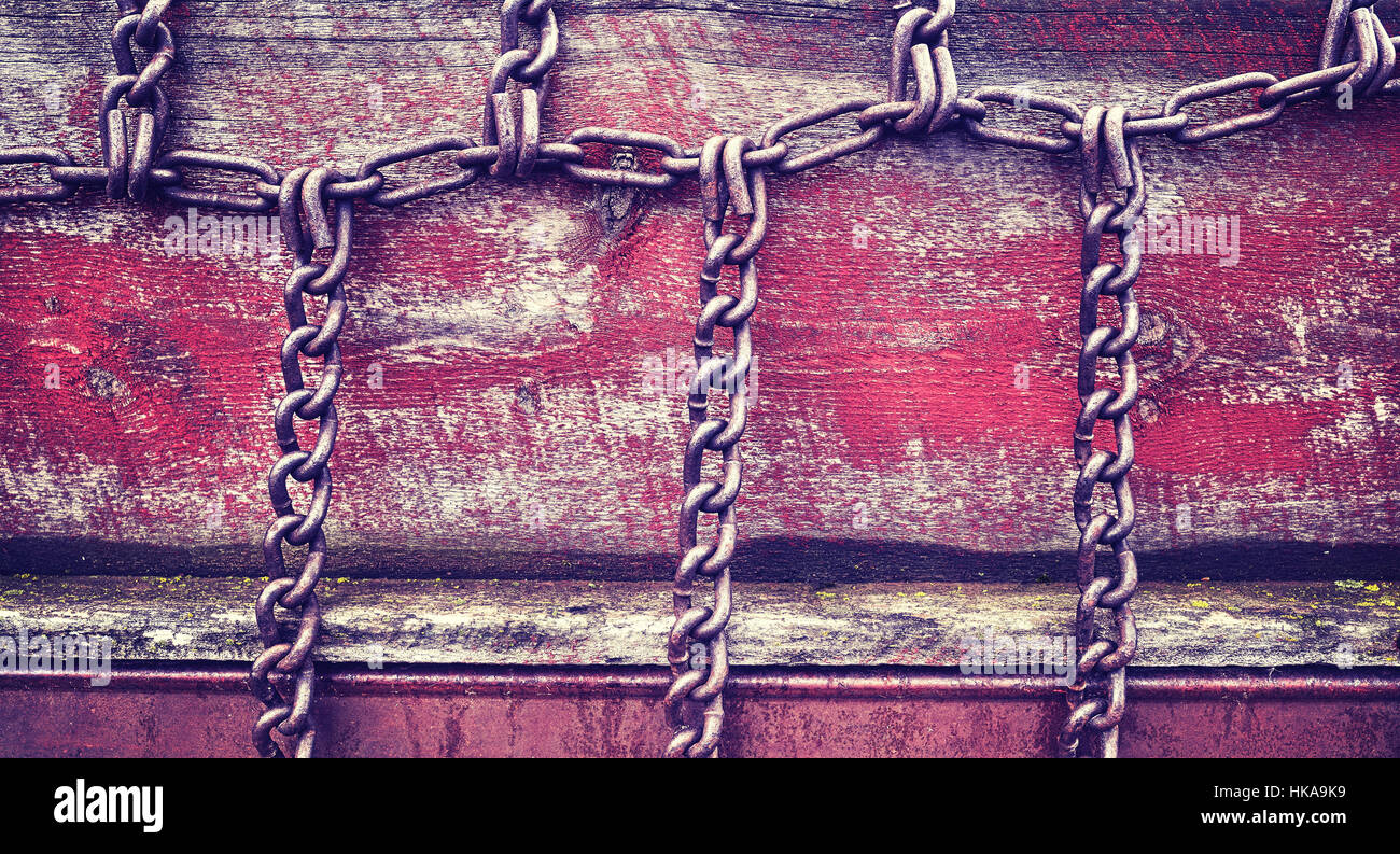 Vintage stylized chains on old wooden wall, grunge background Stock ...