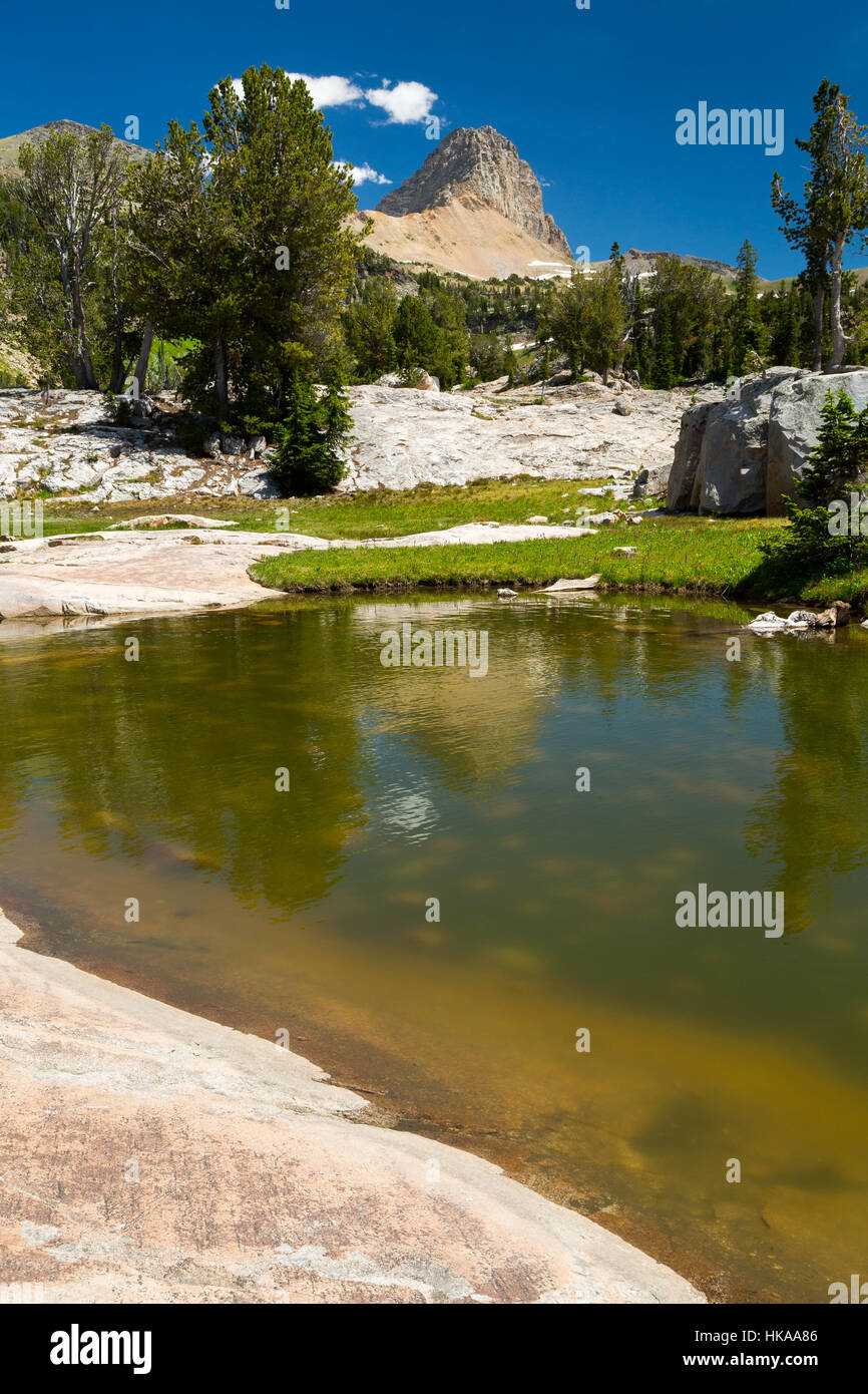 A small lake reflecting Buck Mountain in the Alaska Basin of the Teton ...