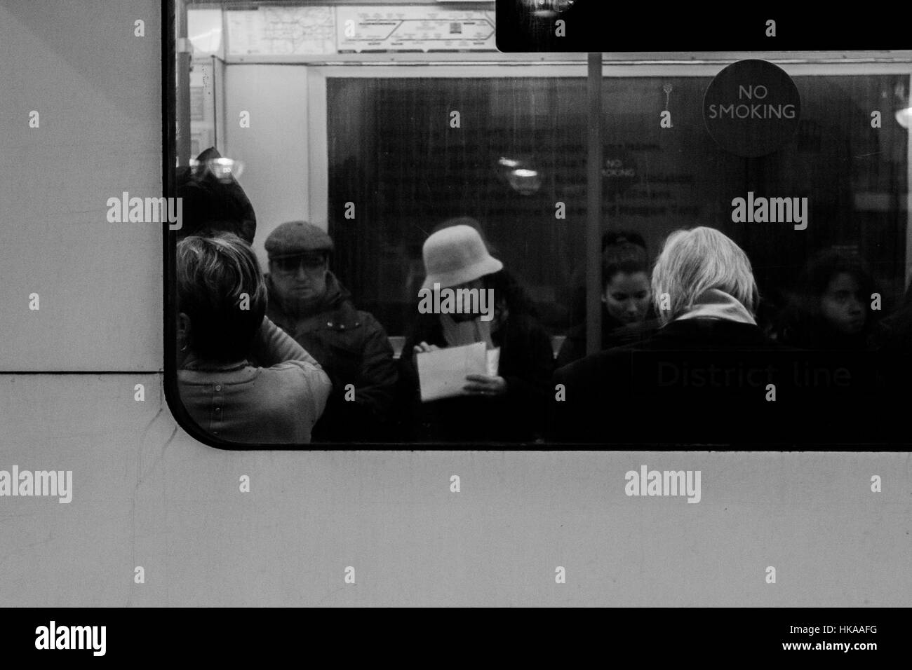 Commuters travel on the tube. London, UK Stock Photo - Alamy