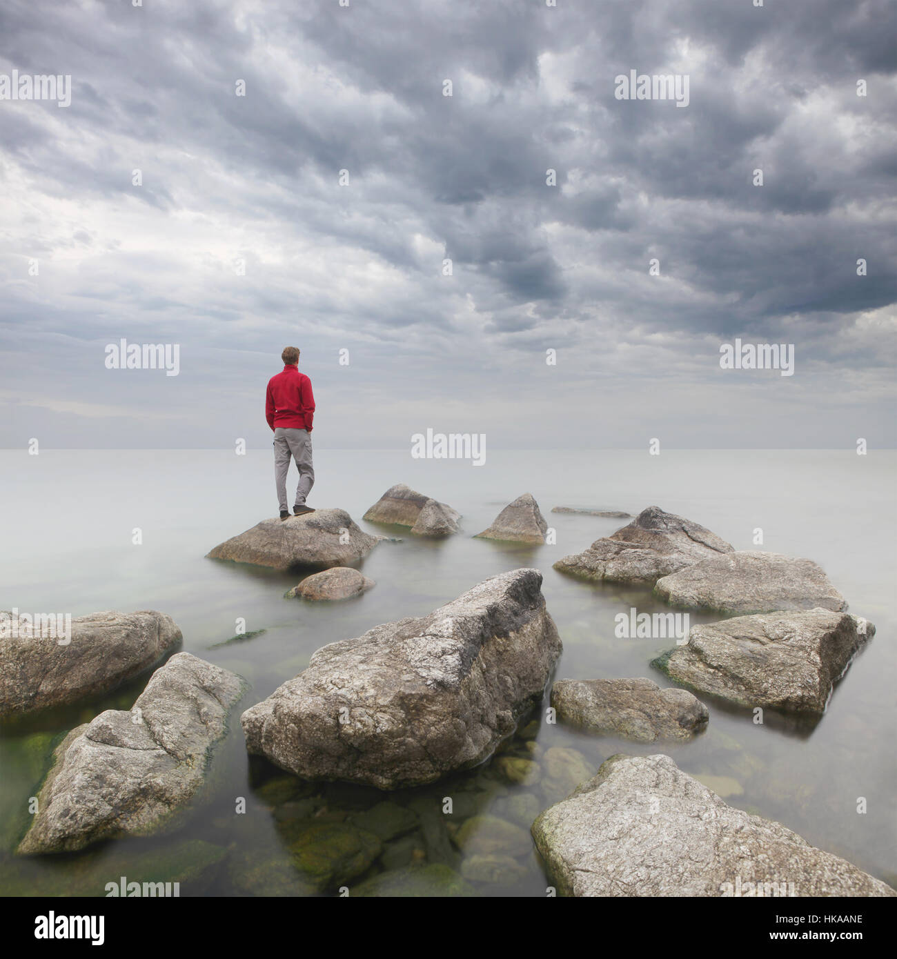Man staring at the sea Stock Photo - Alamy