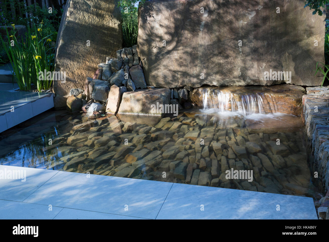 Modern contemporary garden with a small pond water feature water fall ...