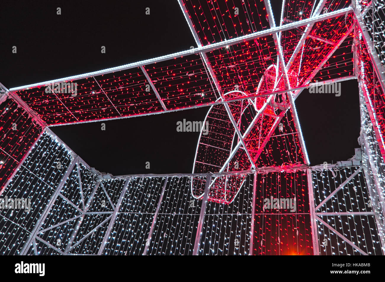 Giant Christmas gift box with lightbulbs at night Stock Photo - Alamy