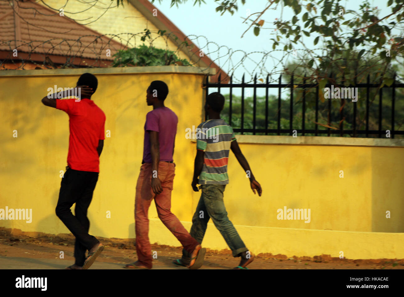 Three Men Walking Stock Photo - Alamy