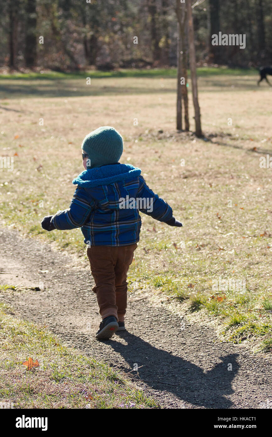 Boy playing with shadow in the street hi-res stock photography and ...