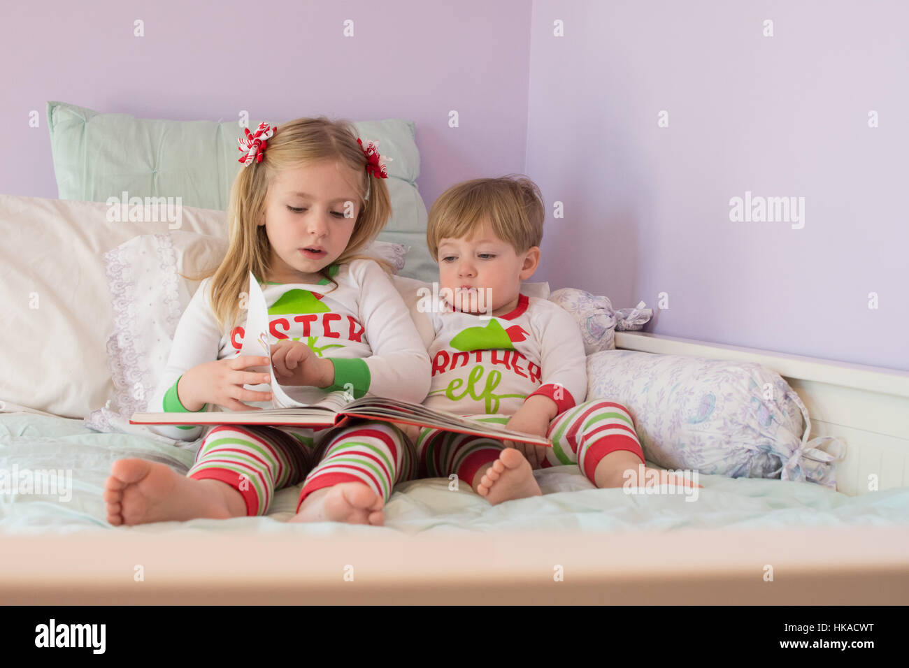 adorable brother and sister siblings reading story together storytime ...