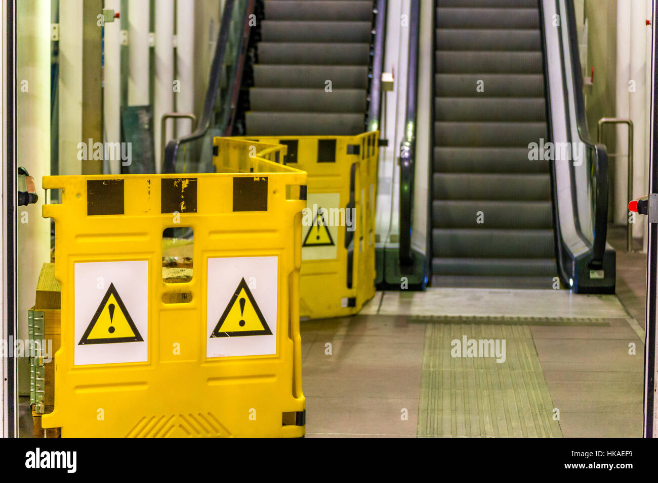under construction signboards blocking access to damaged flight of ...