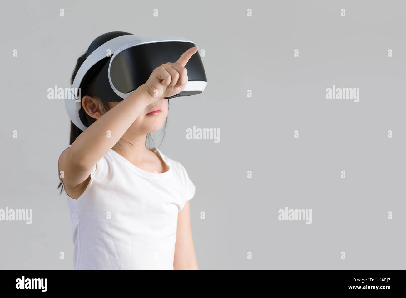Studio shot of child with virtual reality, VR, headset, isolated on ...