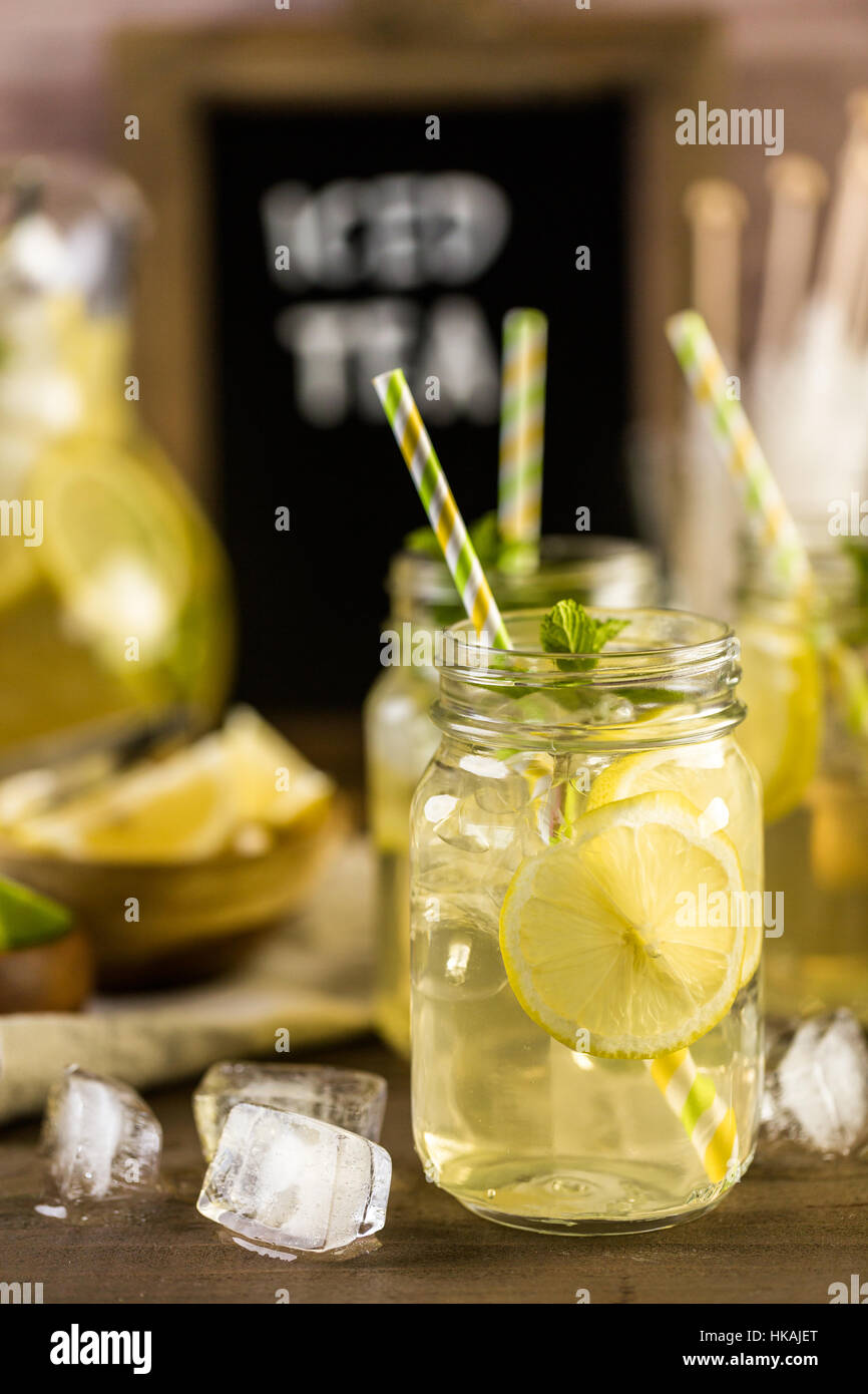 Green tea with citrus in drinking mason jar with ice Stock Photo - Alamy