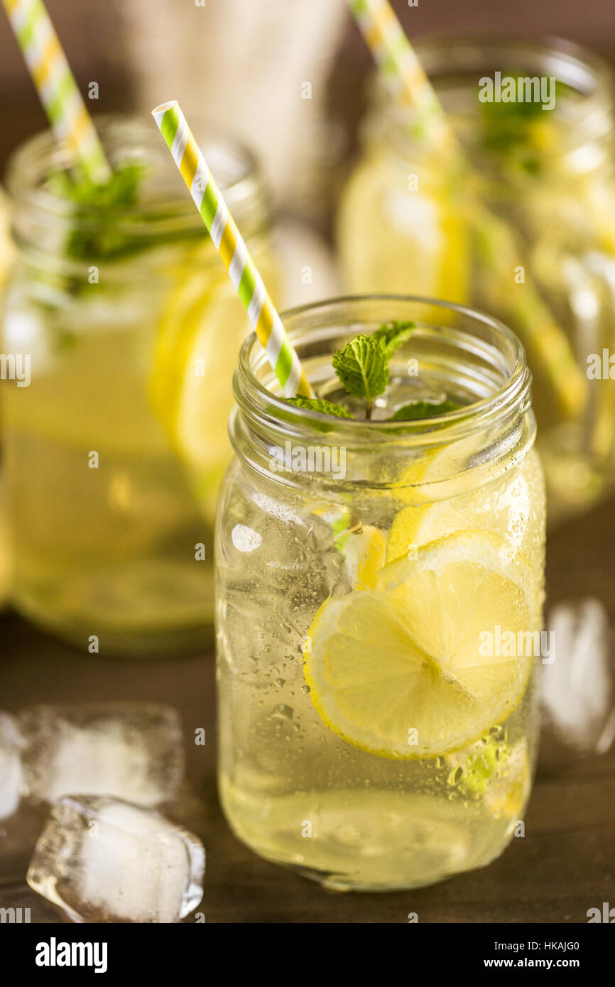 Green tea with citrus in drinking mason jar with ice Stock Photo - Alamy
