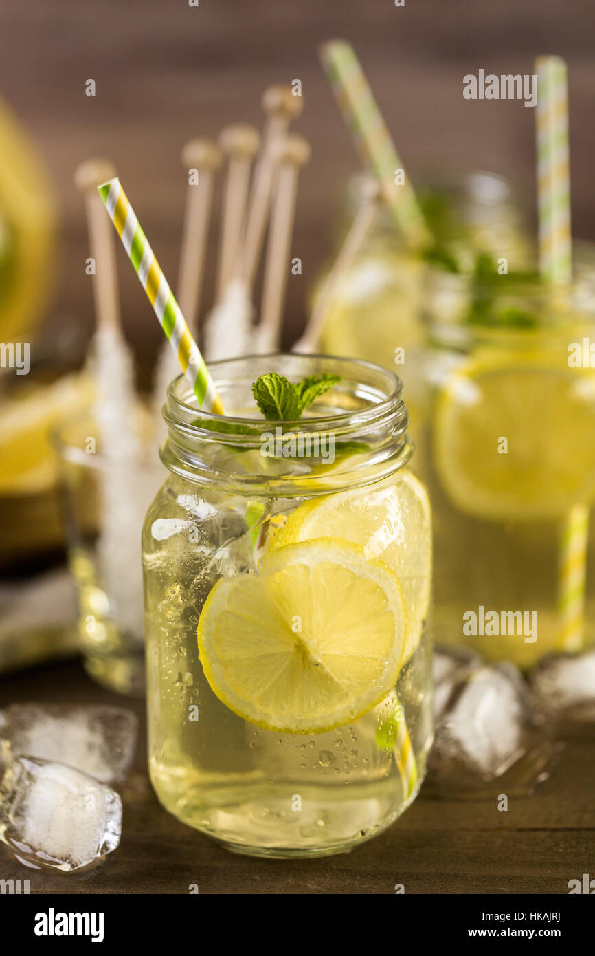 Green tea with citrus in drinking mason jar with ice Stock Photo - Alamy