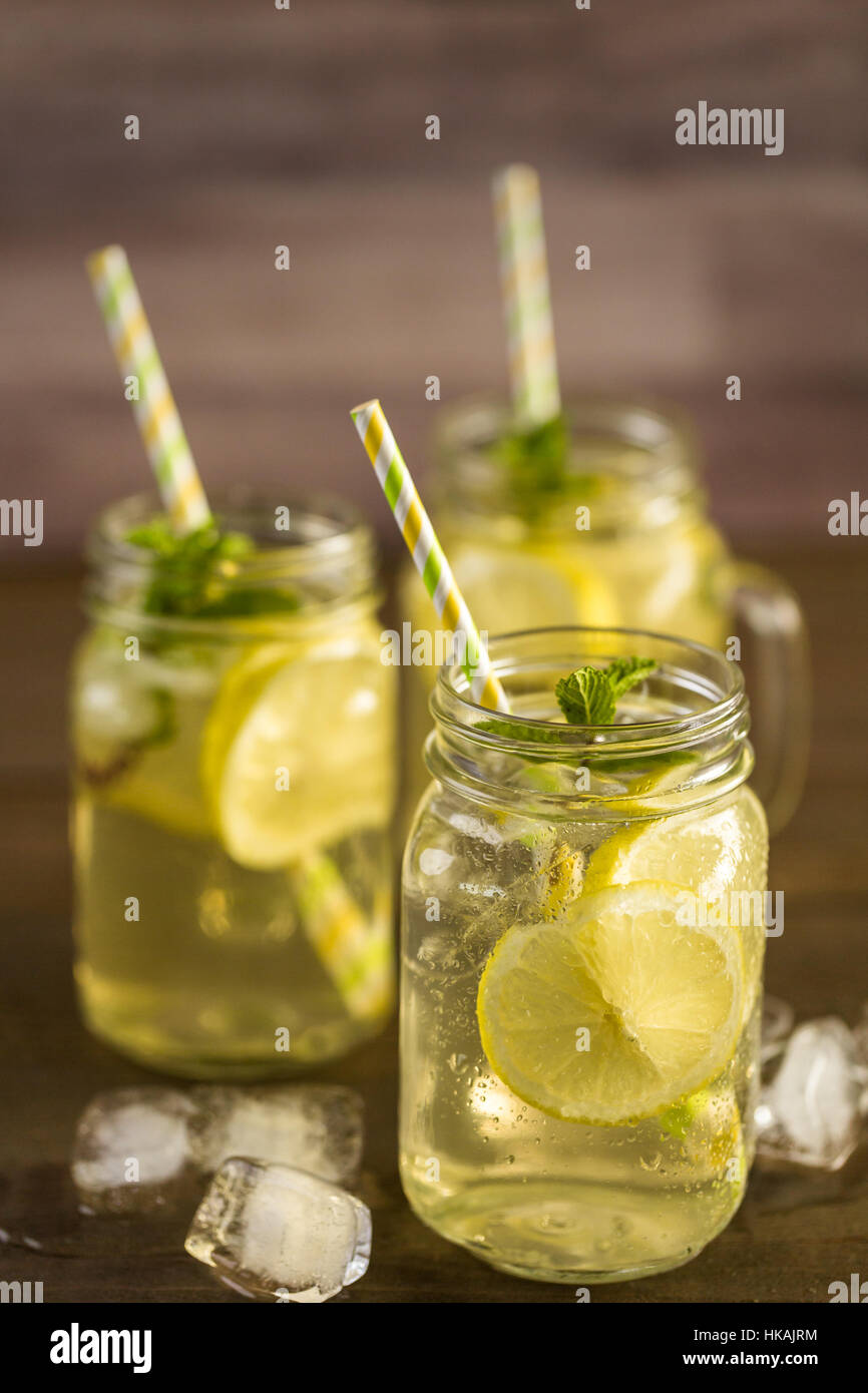 Green tea with citrus in drinking mason jar with ice Stock Photo - Alamy