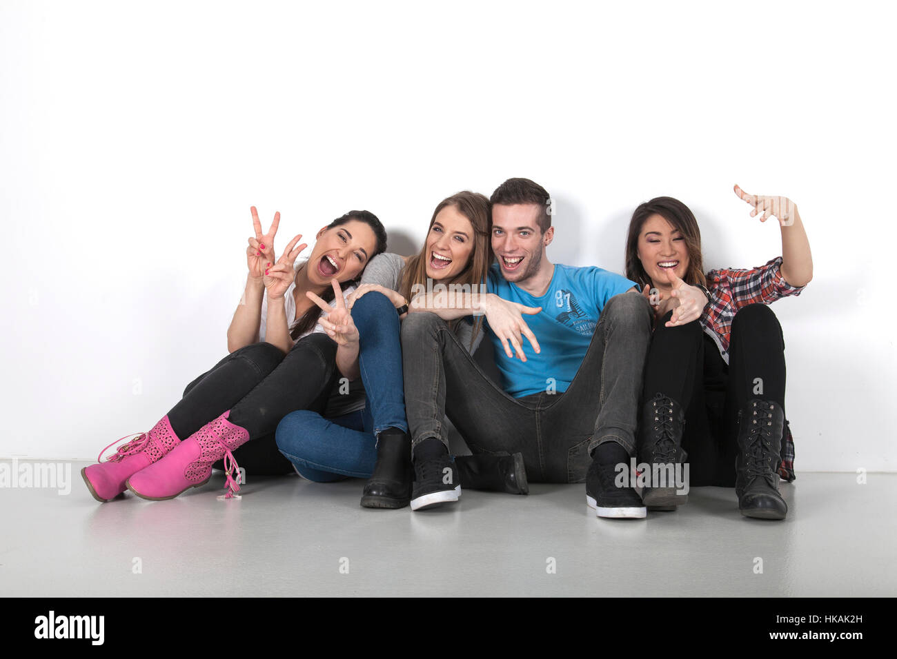 A group of friends posing together Stock Photo - Alamy