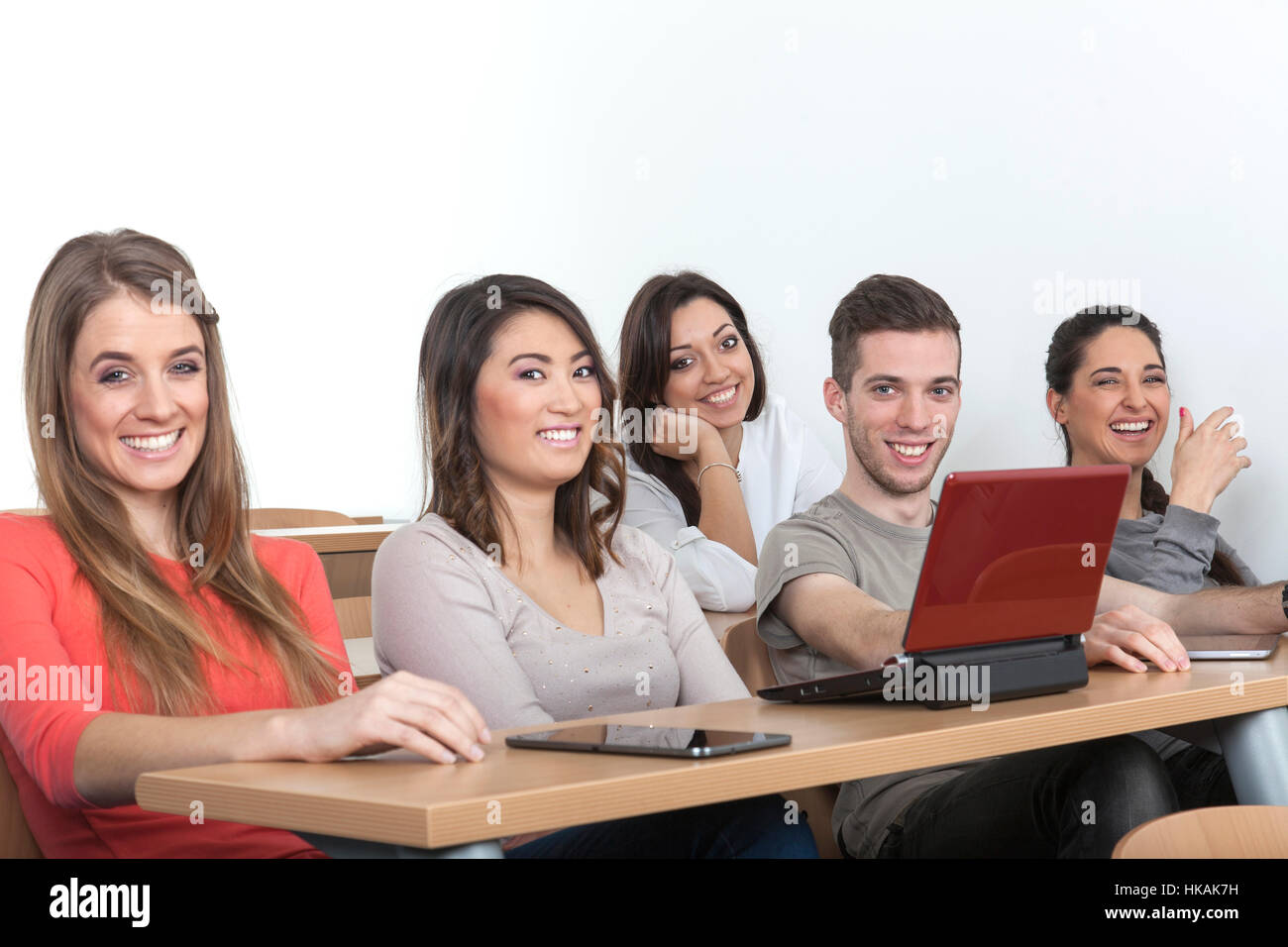 5 students laughing in the lecture hall Stock Photo - Alamy