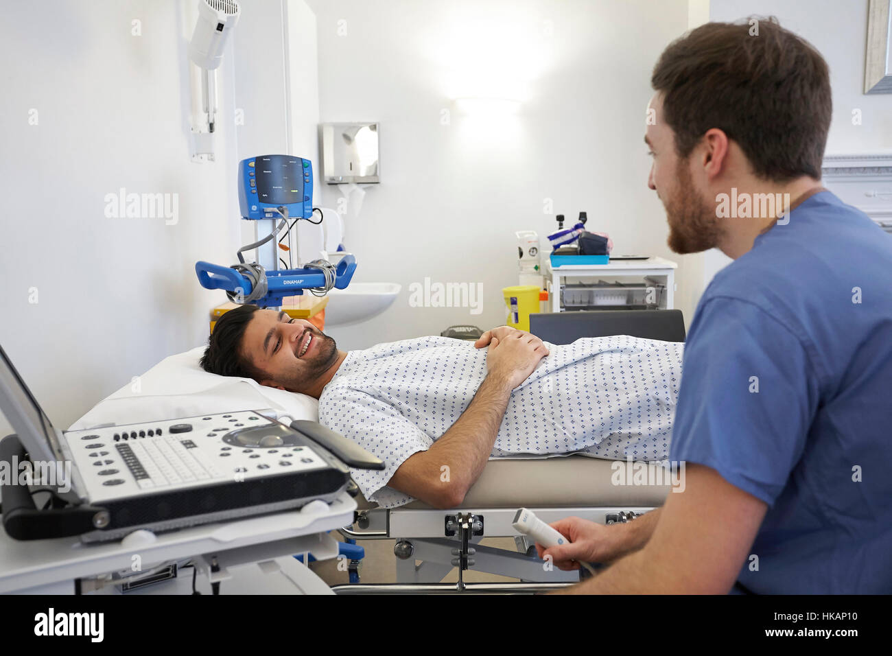 Doctor in discussion with a patient after doing some tests in a ... Doctor in discussion with a patient after doing some tests in a ...