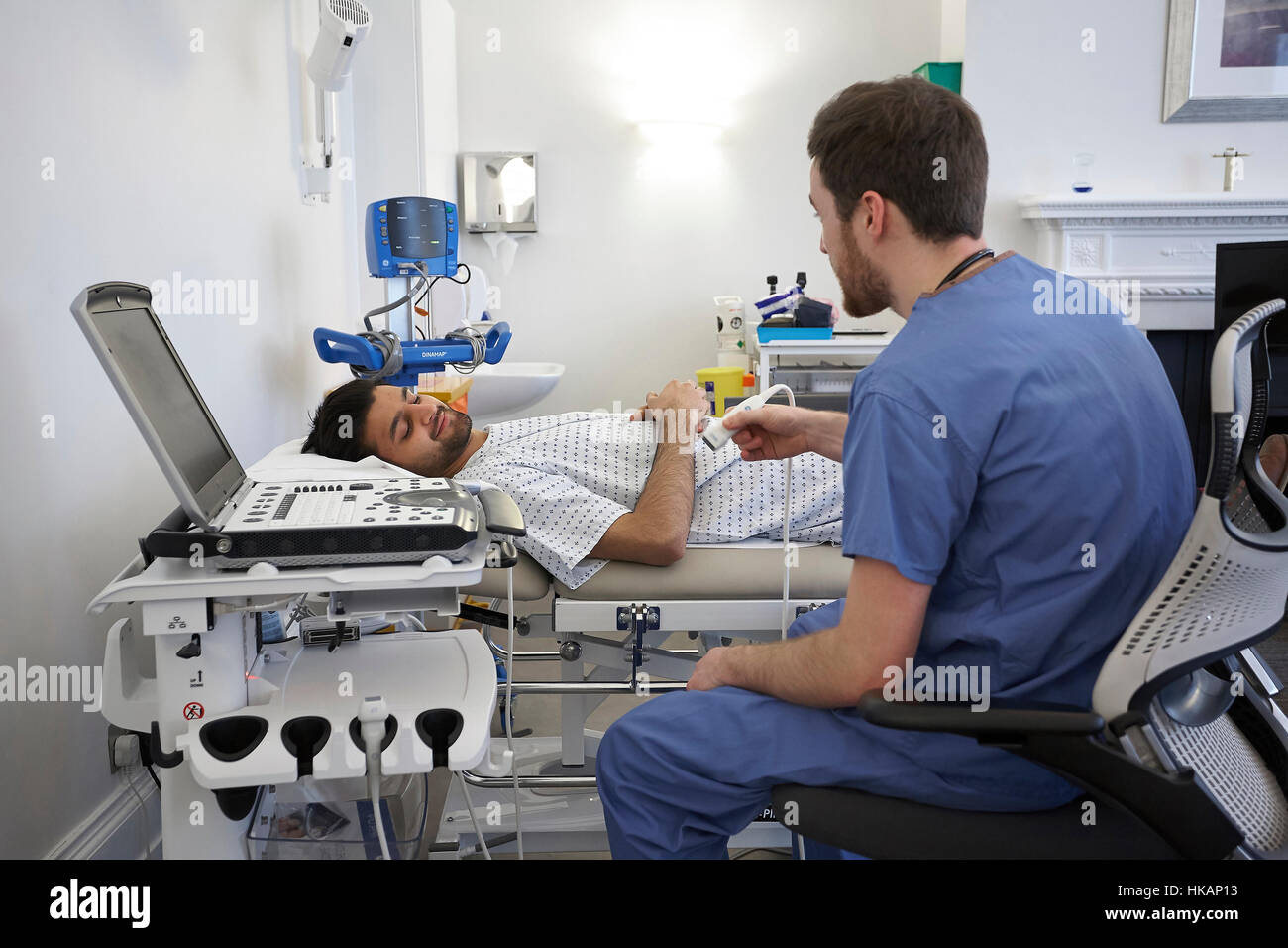 Doctor in discussion with a patient after doing some tests in a ... Doctor in discussion with a patient after doing some tests in a ...