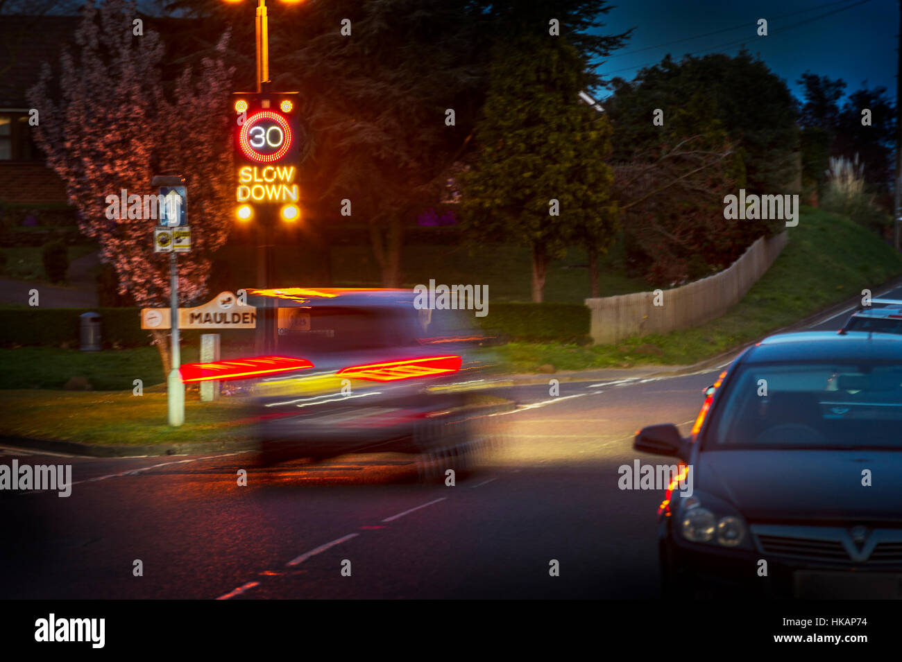 Car Speeding past Speed sign in 30 mph zone Stock Photo - Alamy
