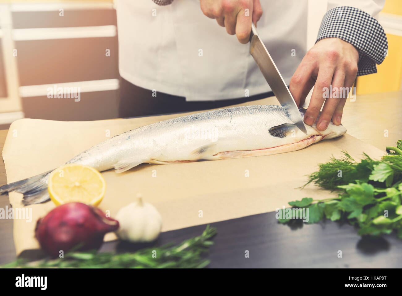 chef cutting salmon fish at restaurant kitchen Stock Photo - Alamy