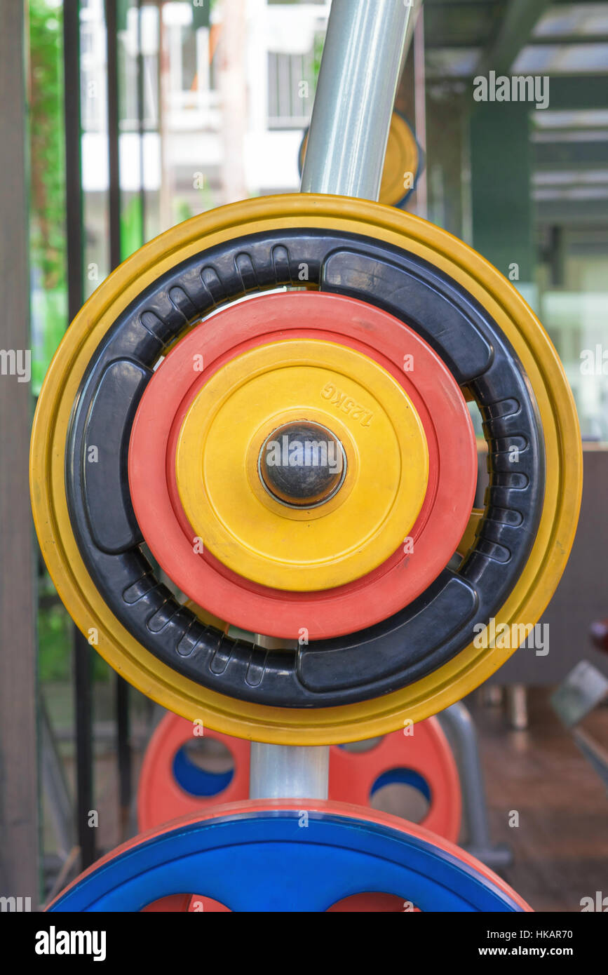 Exercising equipment at the gym, barbell front view Stock Photo - Alamy
