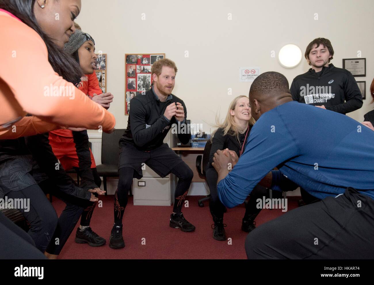 Prince Harry joins a warm up before jogging with volunteers and young ...