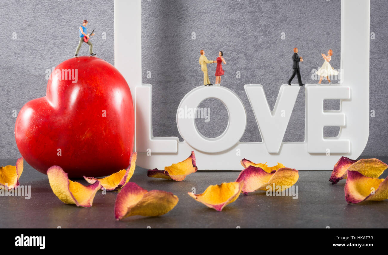 little figures on love text dancing and making music with rose petals ...