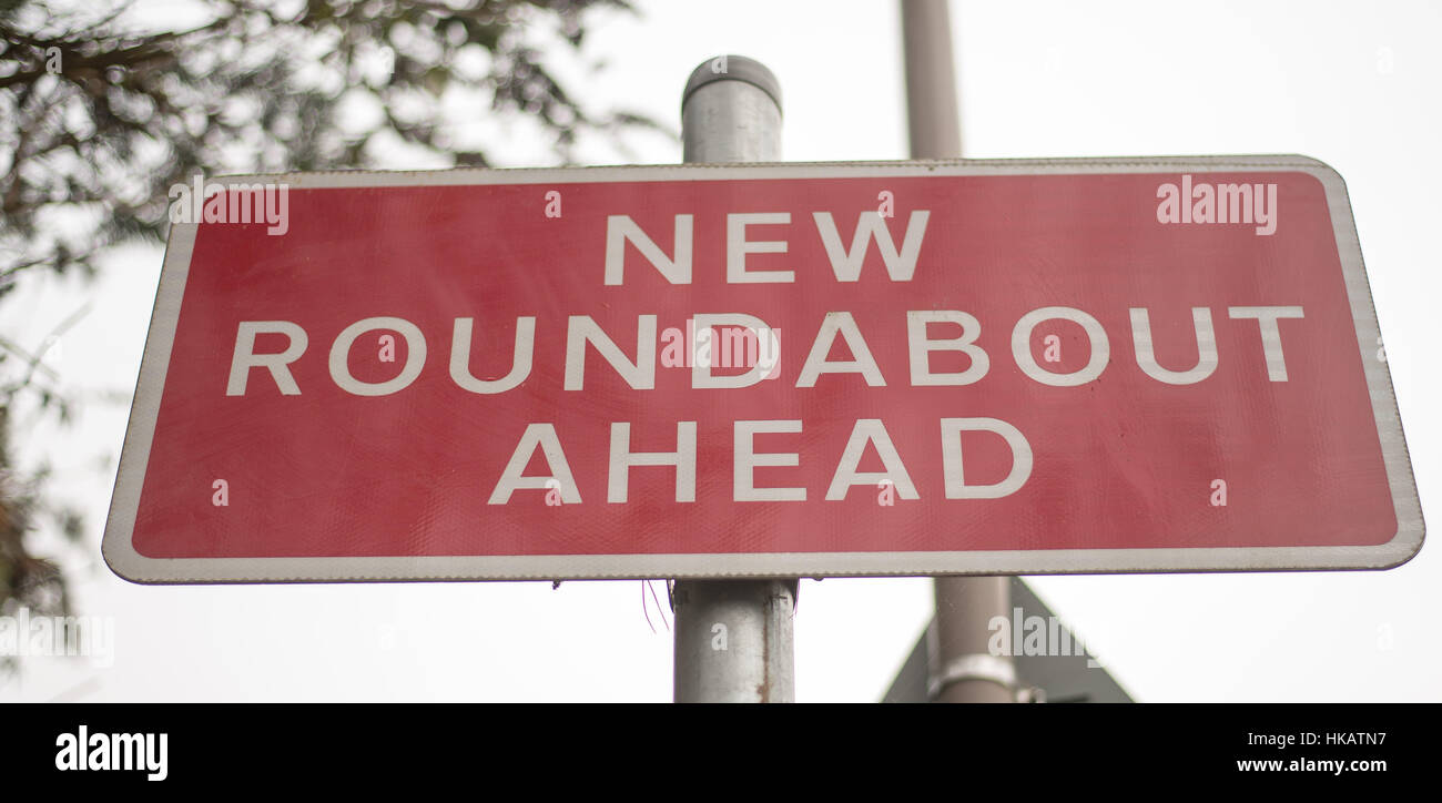 New roundabout ahead sign - uk urban road sign Stock Photo - Alamy