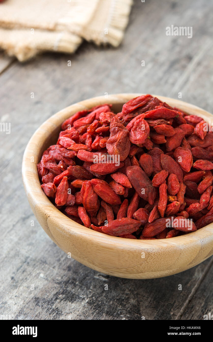 Wolfberries or Goji berries in bowl on wooden table Stock Photo - Alamy