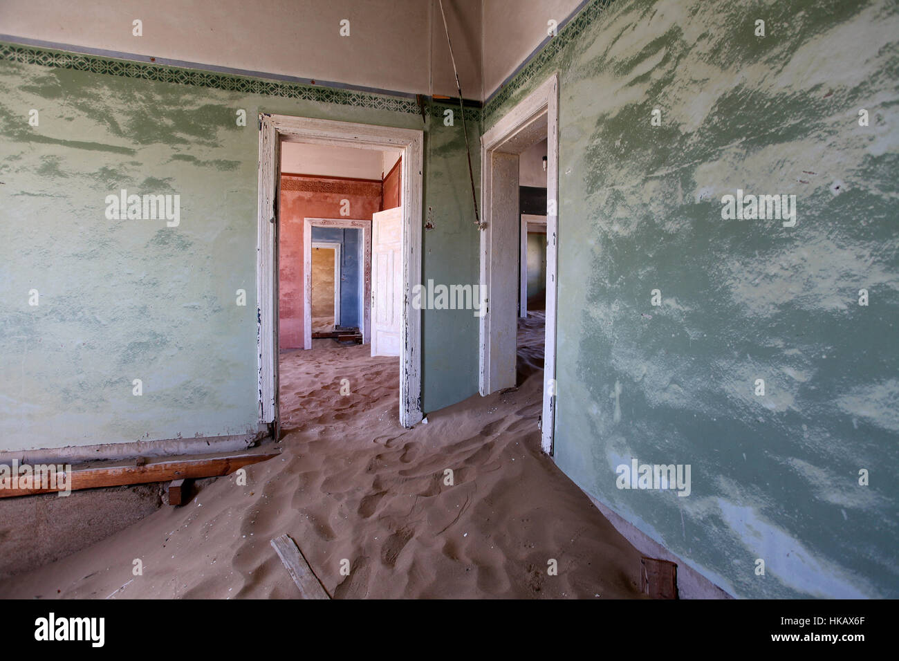 Rooms filling with sand at Kolmanskop abandoned diamond Stock Photo - Alamy