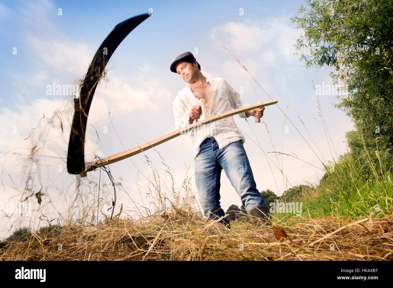 Farmer Cutting Grass With A Scythe High Resolution Stock Photography ...