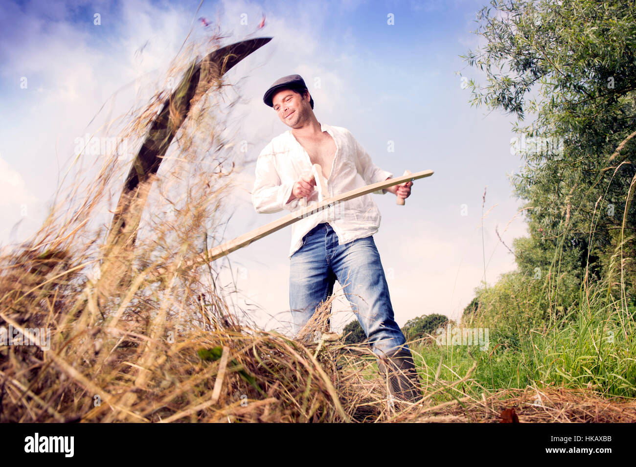 Scything vintage hi-res stock photography and images - Alamy