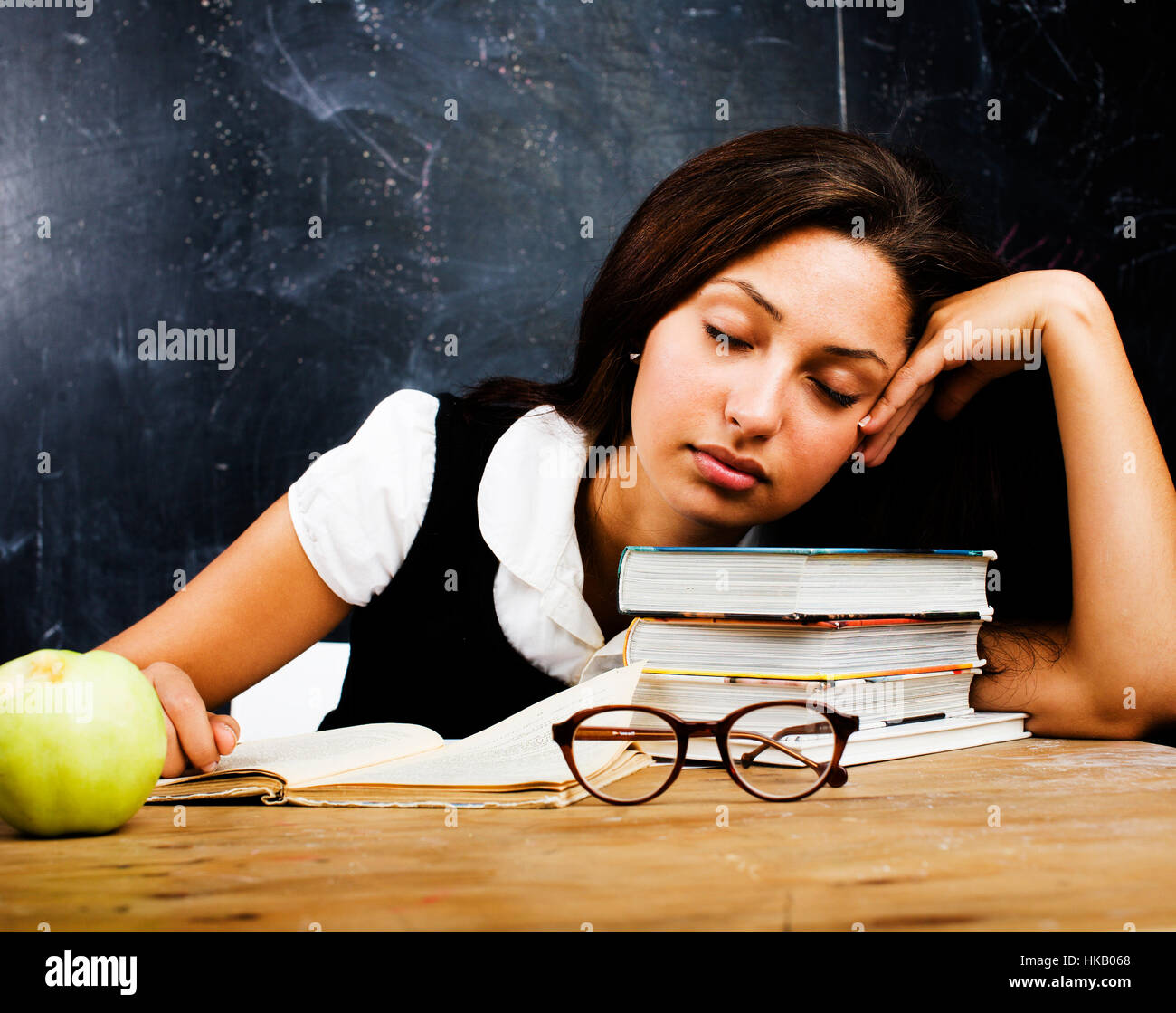 portrait of happy cute student in classroom at blackboard Stock Photo ...