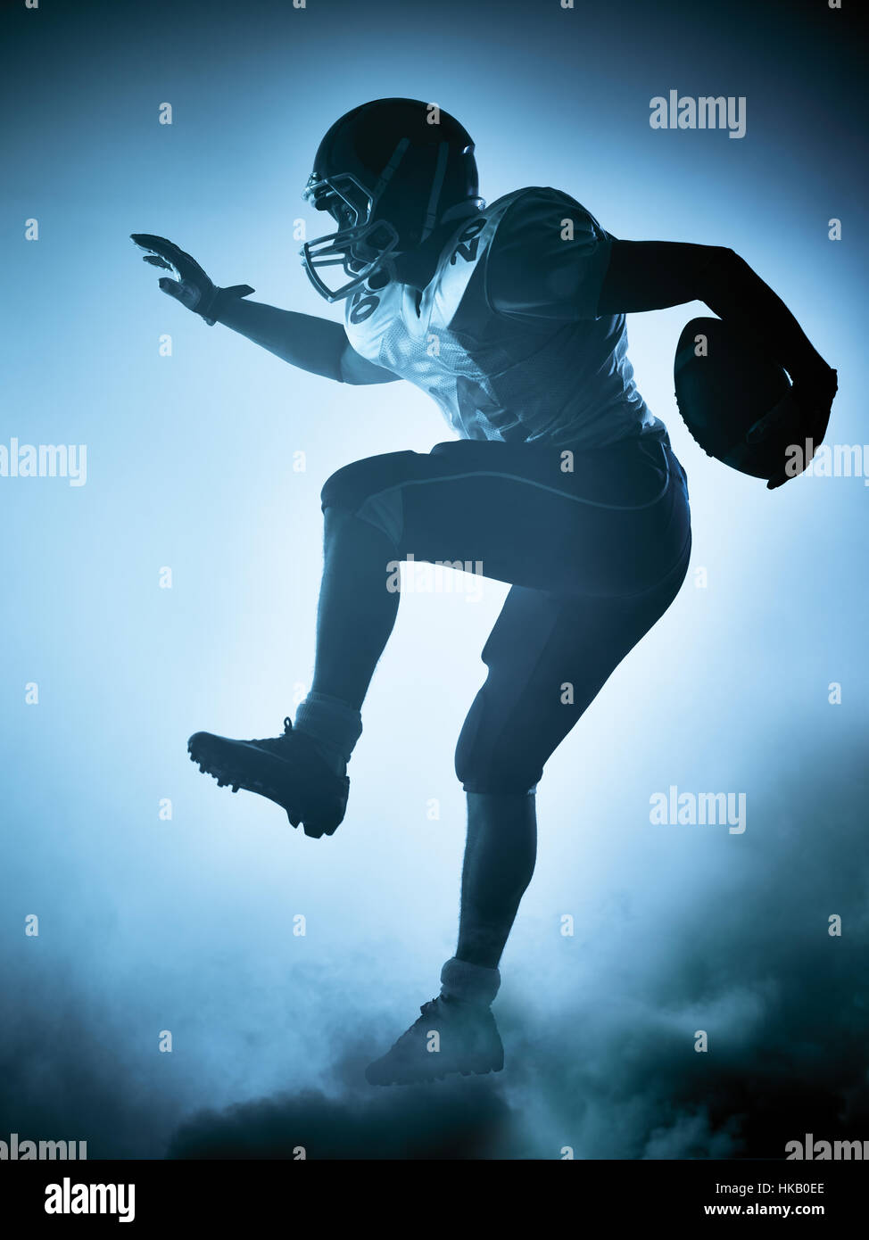 one american football player portrait in silhouette shadow on white ...