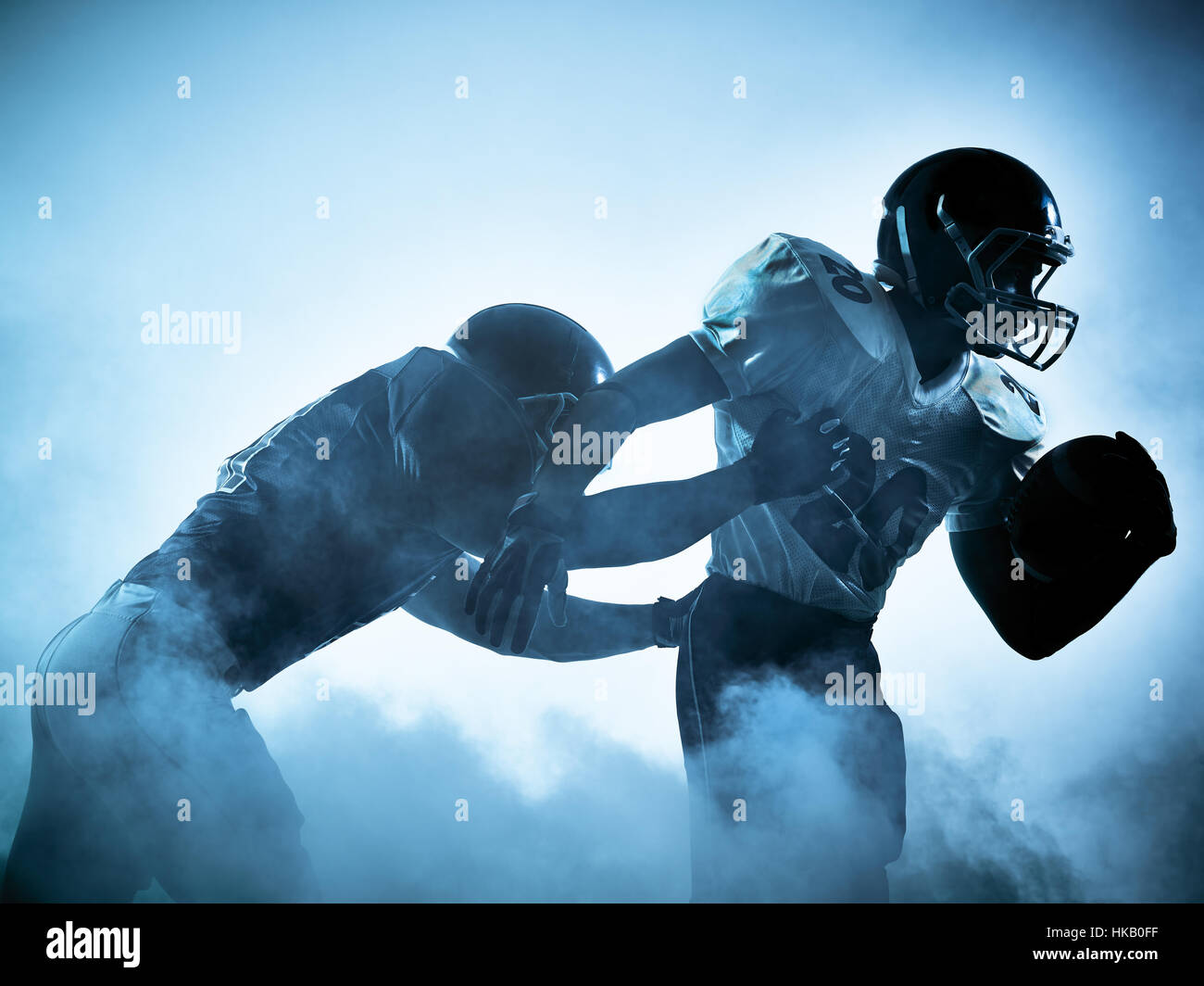 one american football player portrait in silhouette shadow on white ...