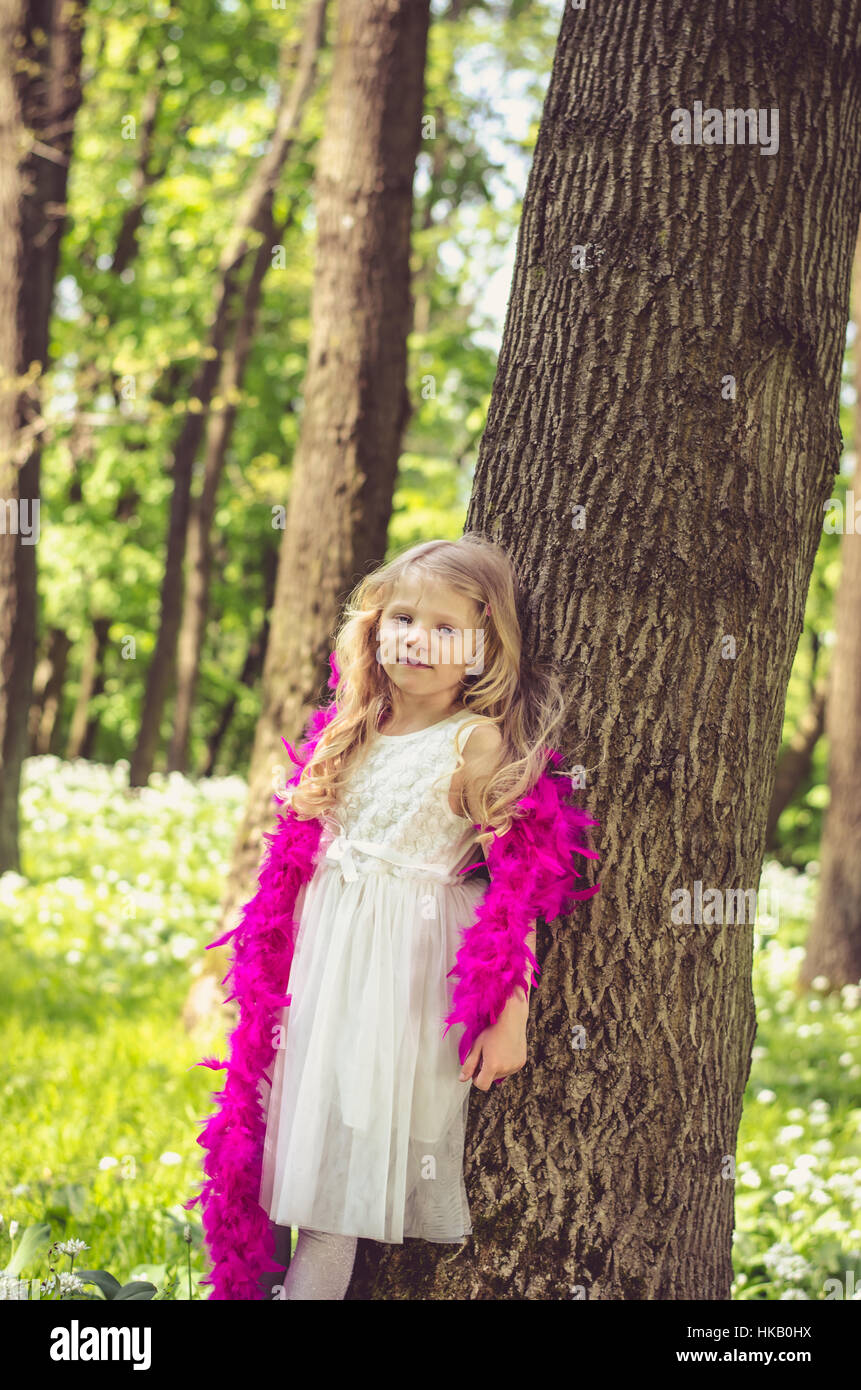 lovely little child in forest Stock Photo - Alamy