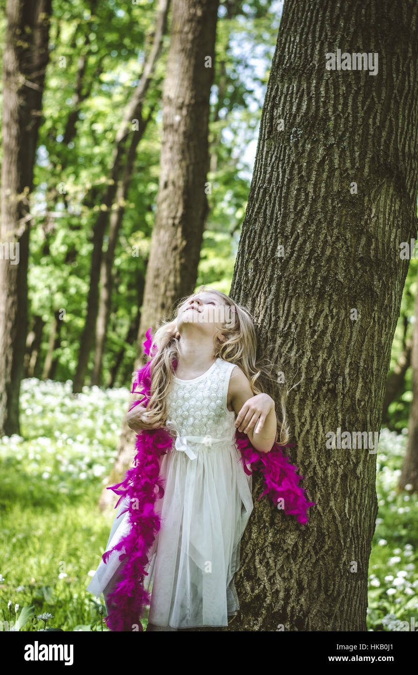 lovely little child in forest Stock Photo - Alamy