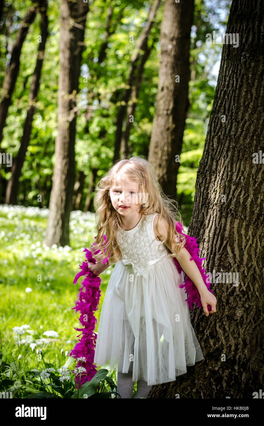 lovely little child in forest Stock Photo - Alamy
