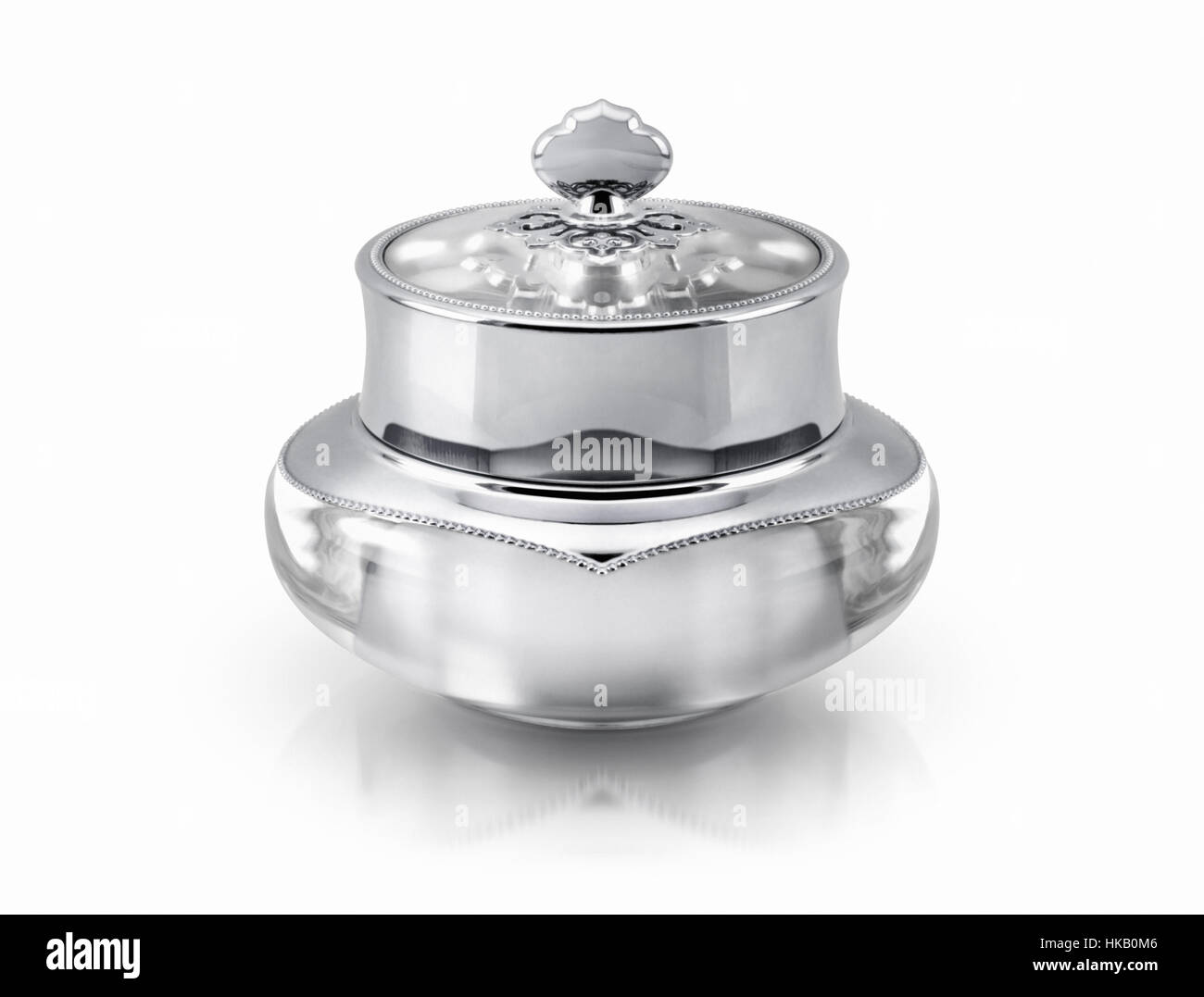 Single silver deluxe cosmetic jar on white background Stock Photo - Alamy