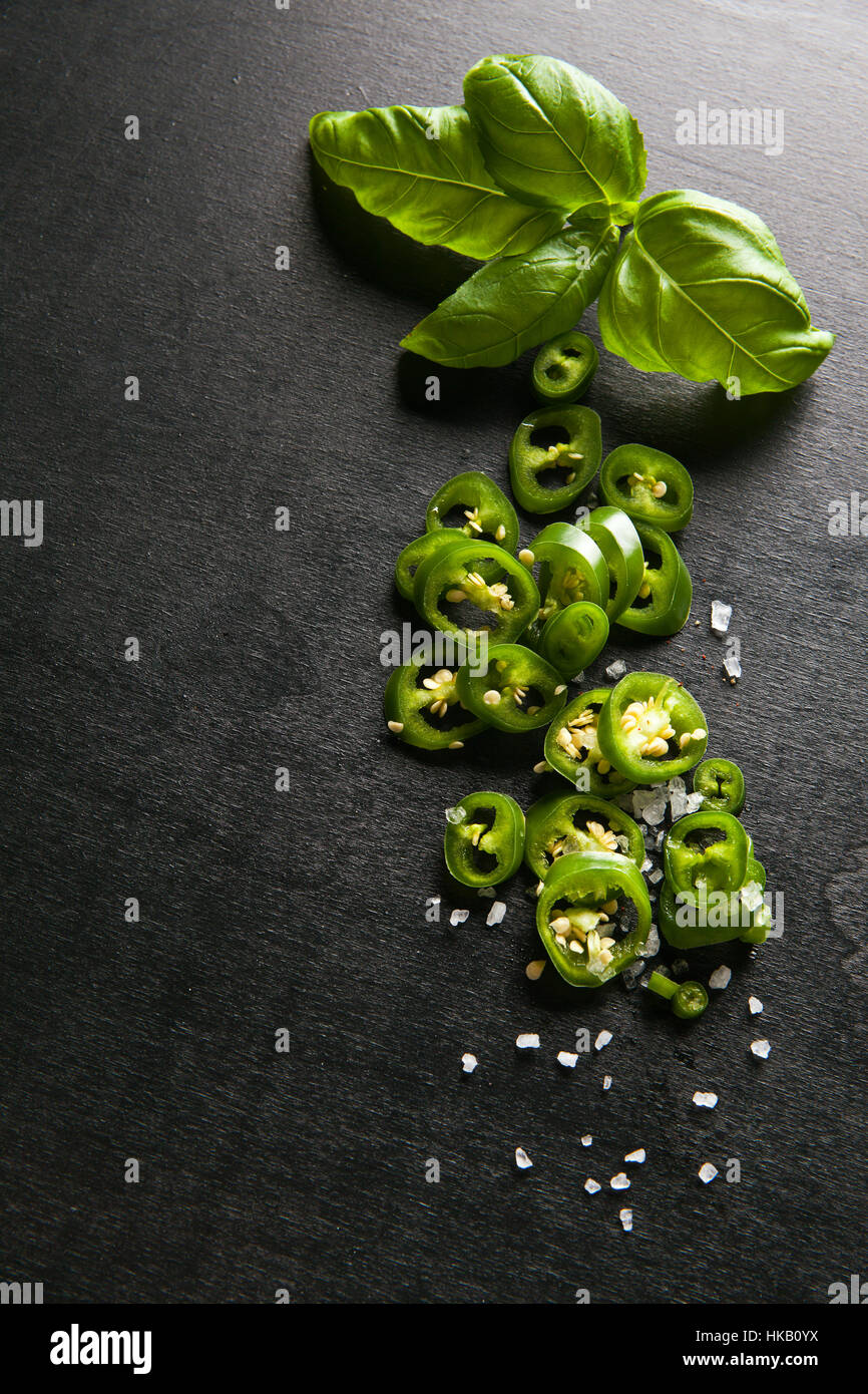 basil leaves with green hot peppers & salt Stock Photo - Alamy