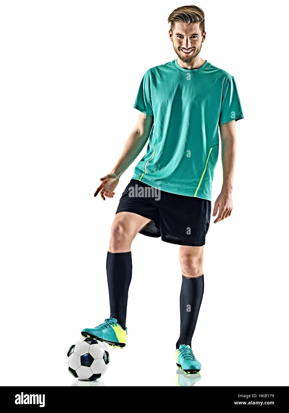 one caucasian soccer player man standing smiling with football isolated ...