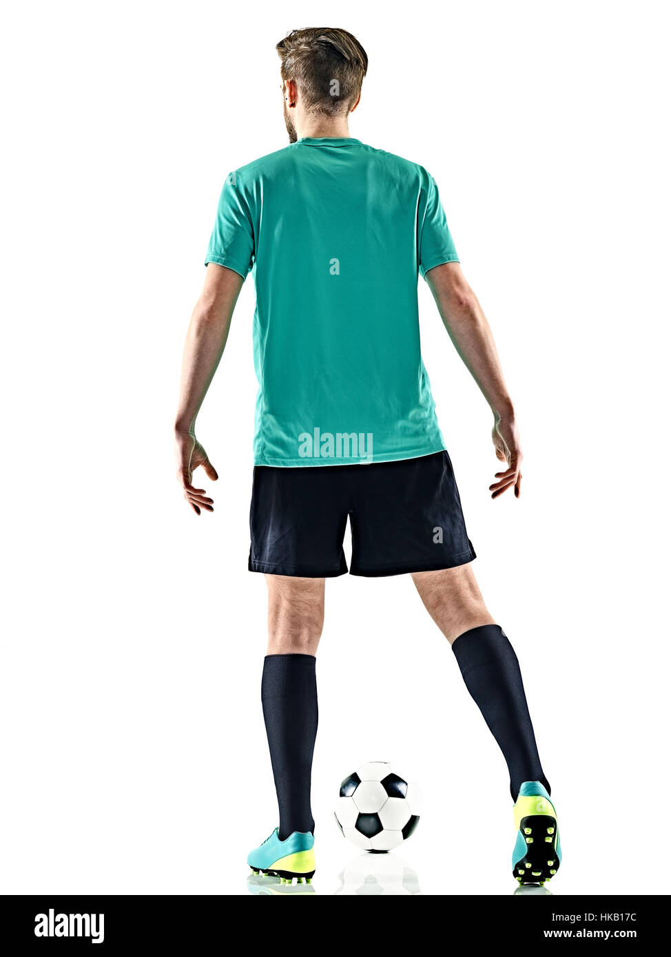 one caucasian soccer player man standing Rear View with football ...