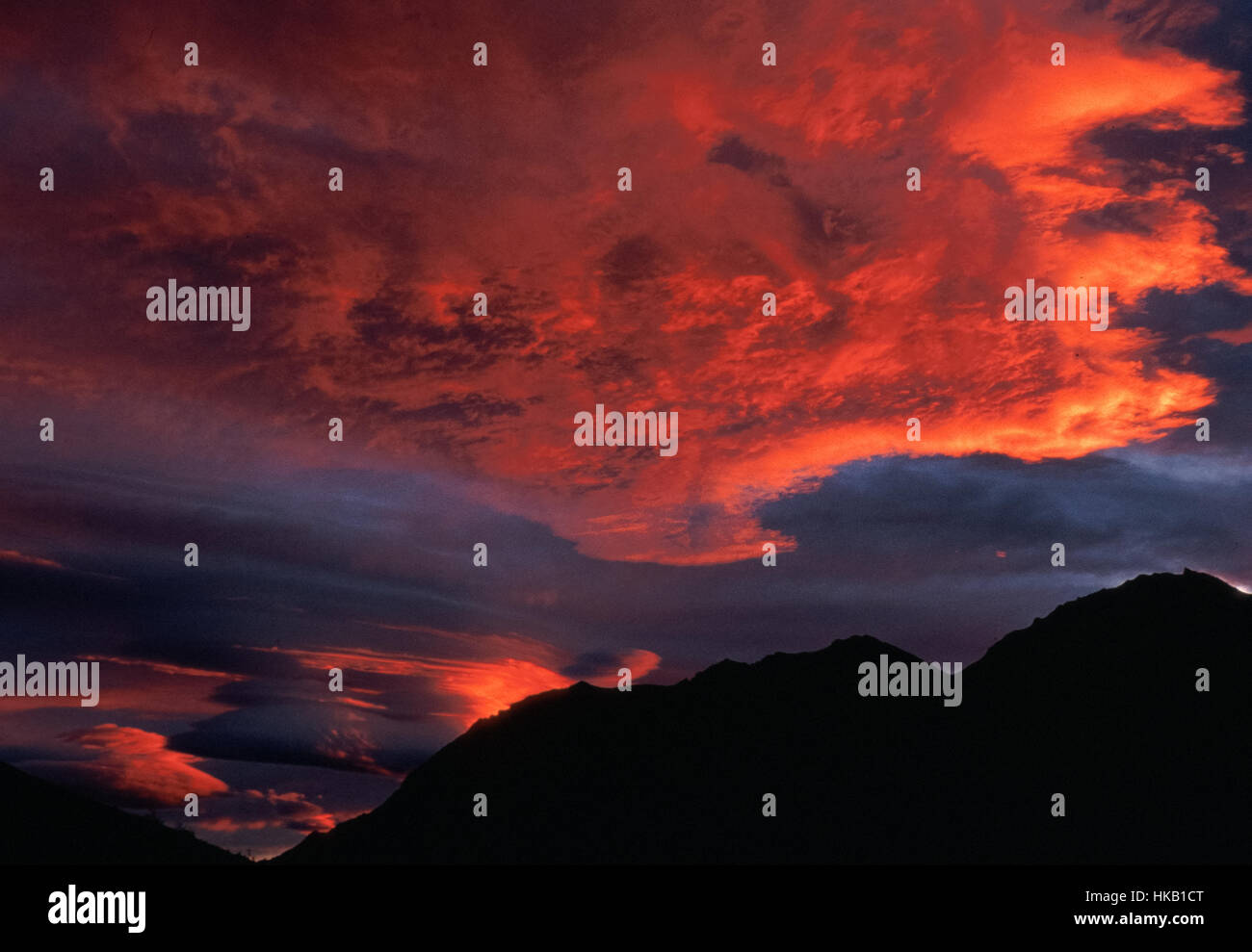 Sunrise orange clouds over mountains, Alaska, Denali National Park ...