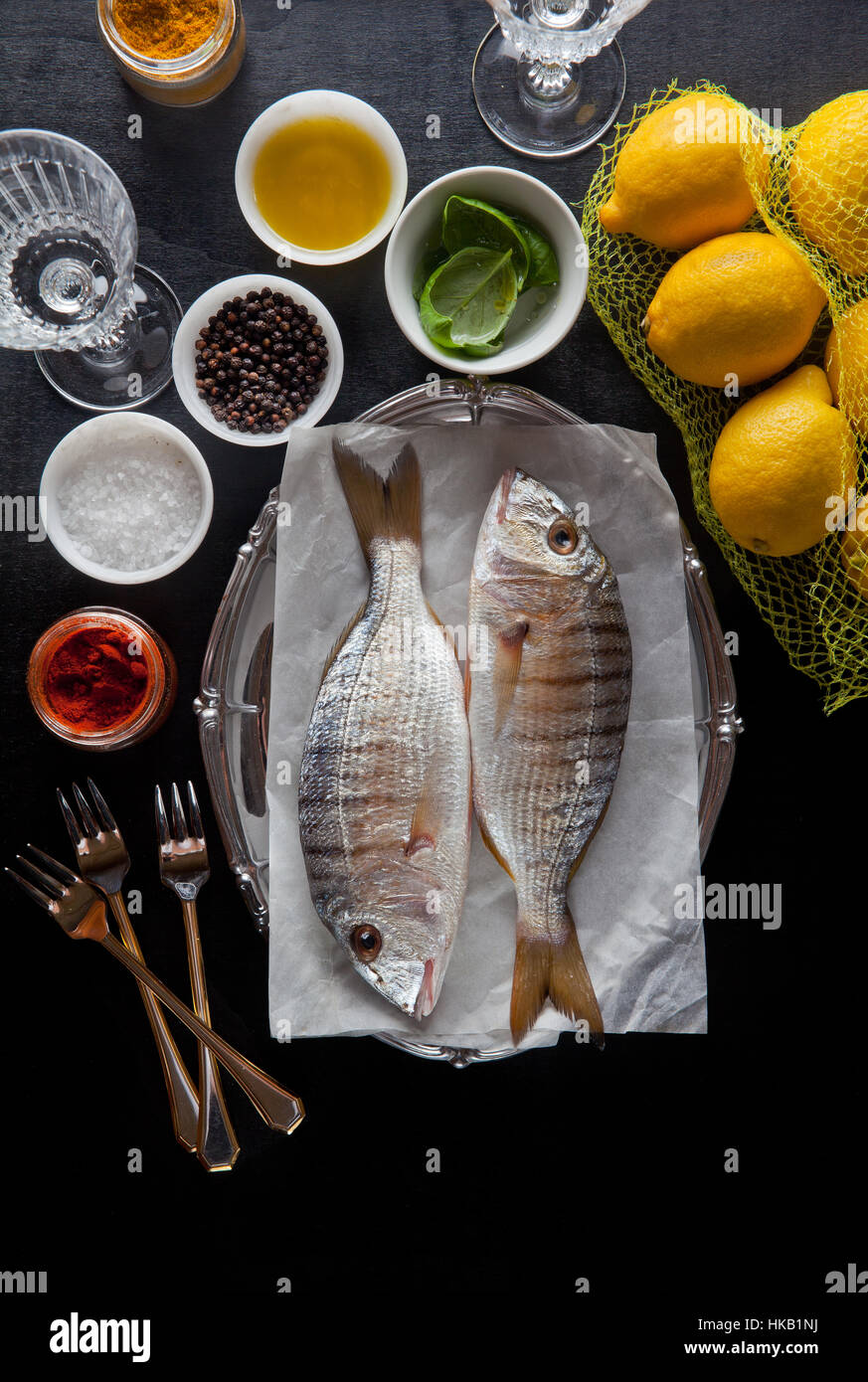 raw fish with cooking ingredients Stock Photo - Alamy