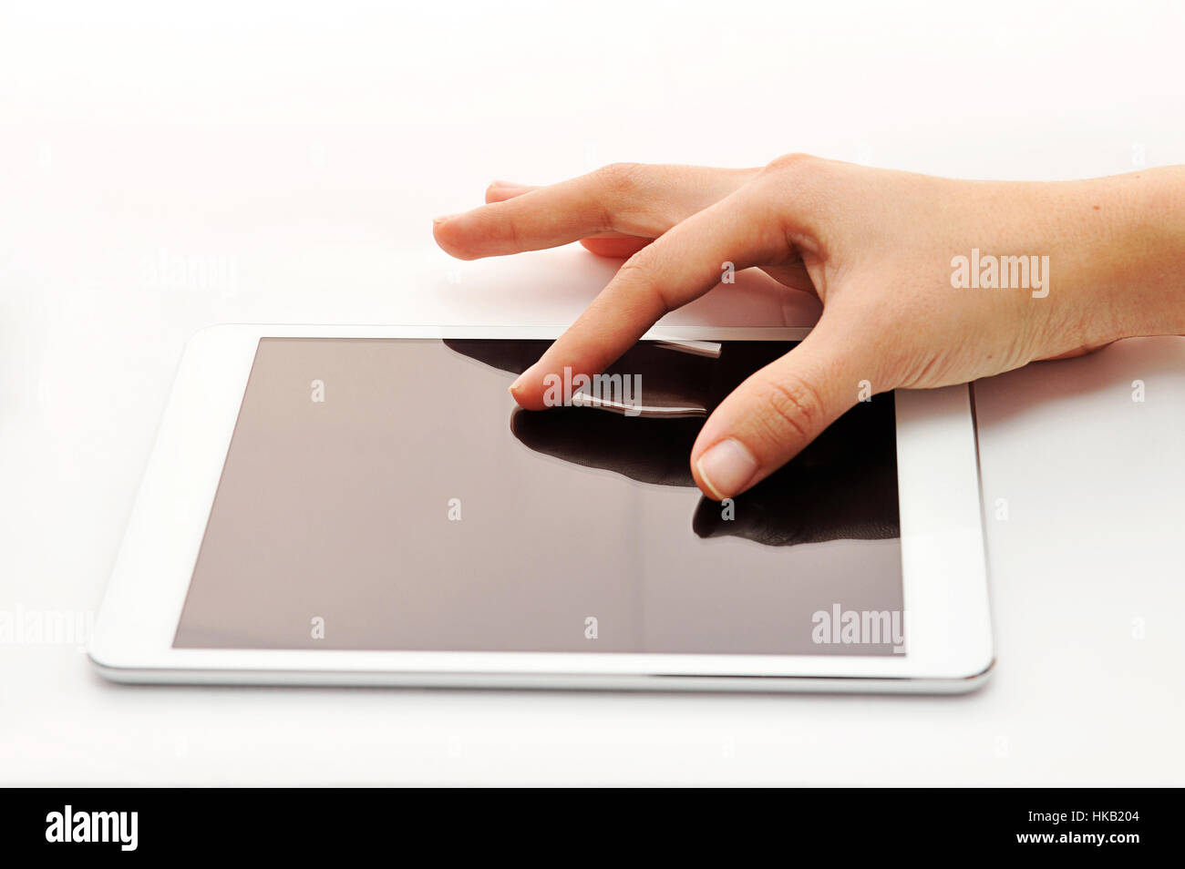 Touching the tablet screen hi-res stock photography and images - Alamy