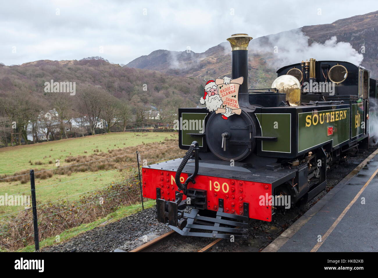 Narrow gauge steam locomotive stands at Beddgelert Station on the Welsh ...