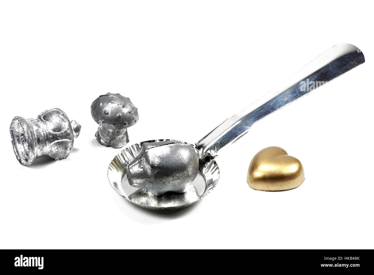 lead pieces and spoon for molybdomancy Stock Photo - Alamy